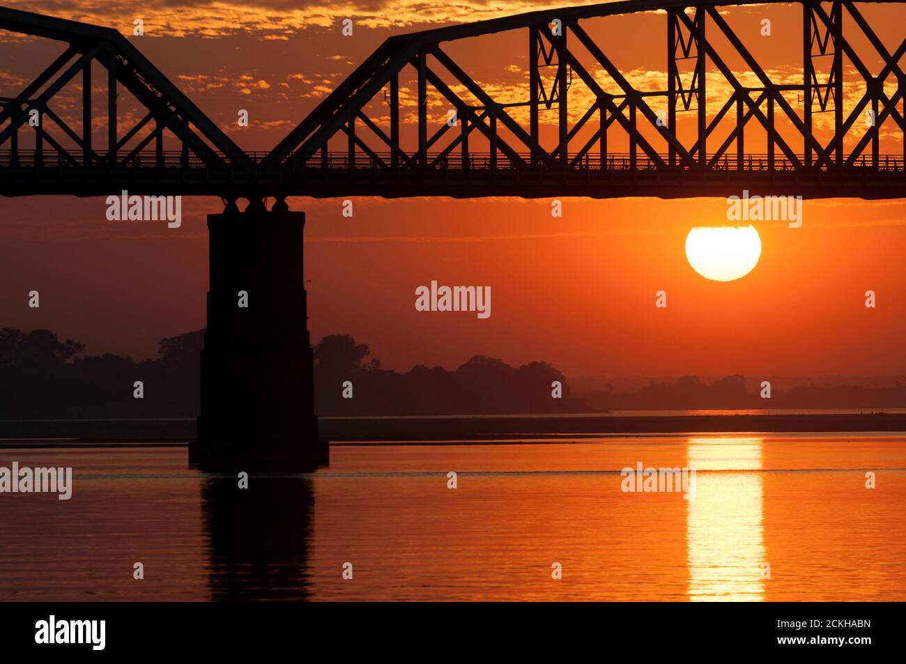 Road bridge on the Irrawaddy river during a sunset in Myanmar Stock ...