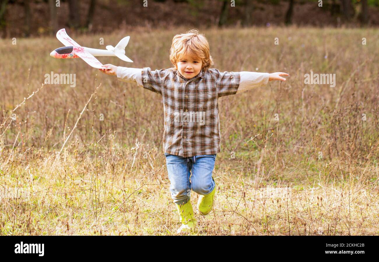 Little boy with plane. Little kid dreams of being a pilot. Child ...