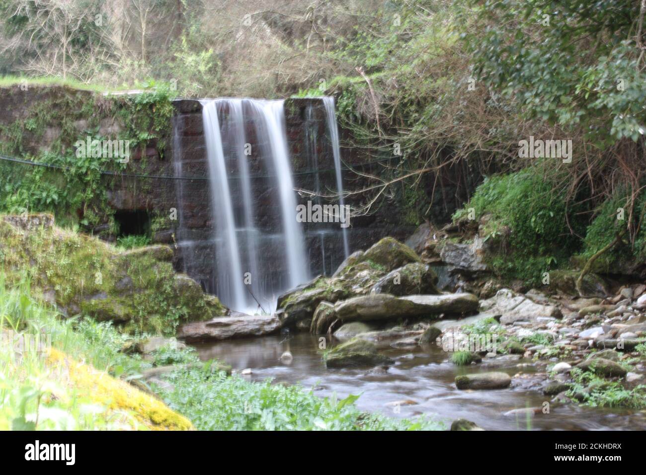 water path with silk effect. small river flowing from the waterfall in ...