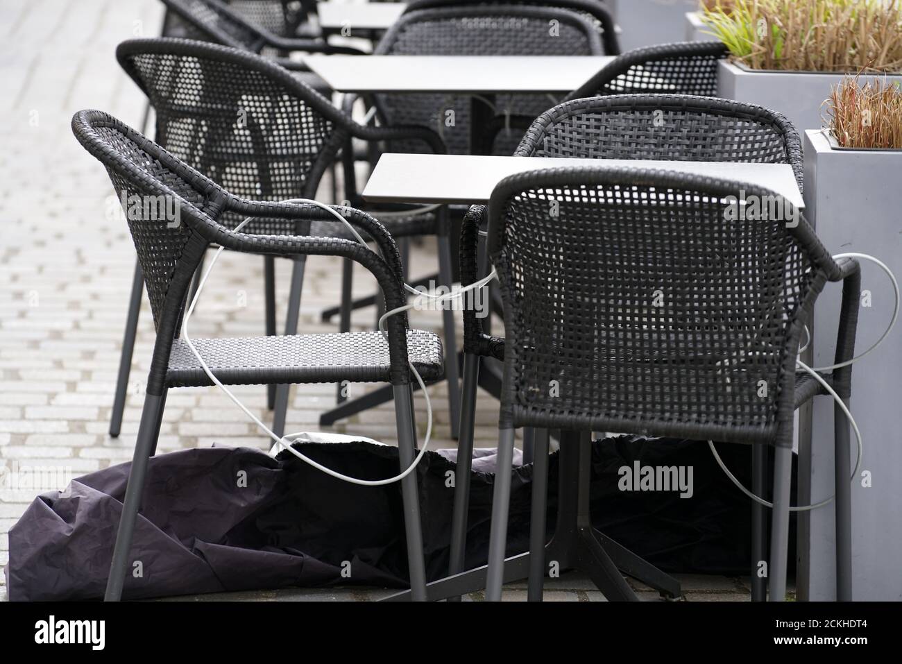 Outdoor cafe with tables and chairs at daytime Stock Photo - Alamy