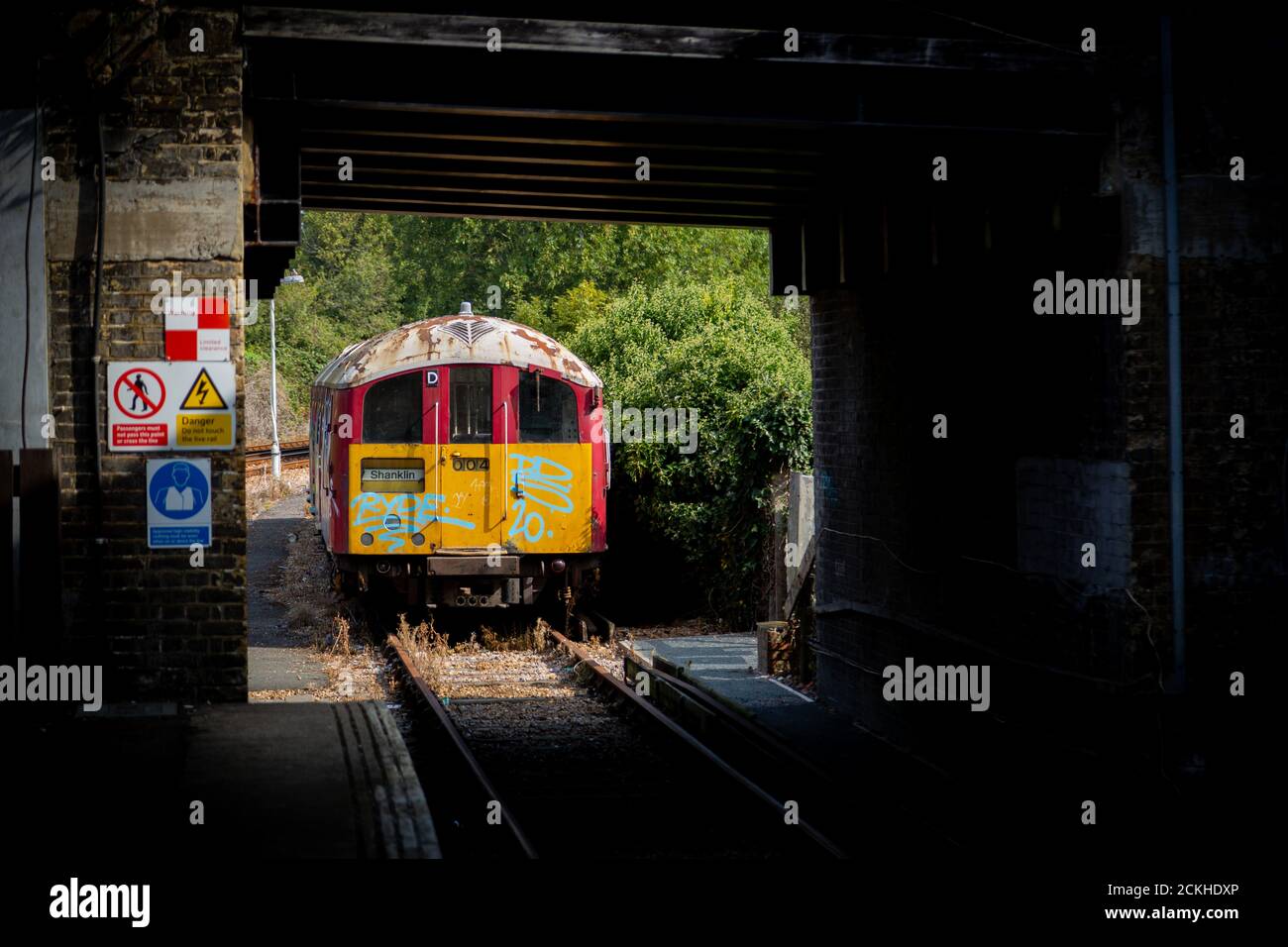 An underground or tube train entering a small tunnel Stock Photo - Alamy