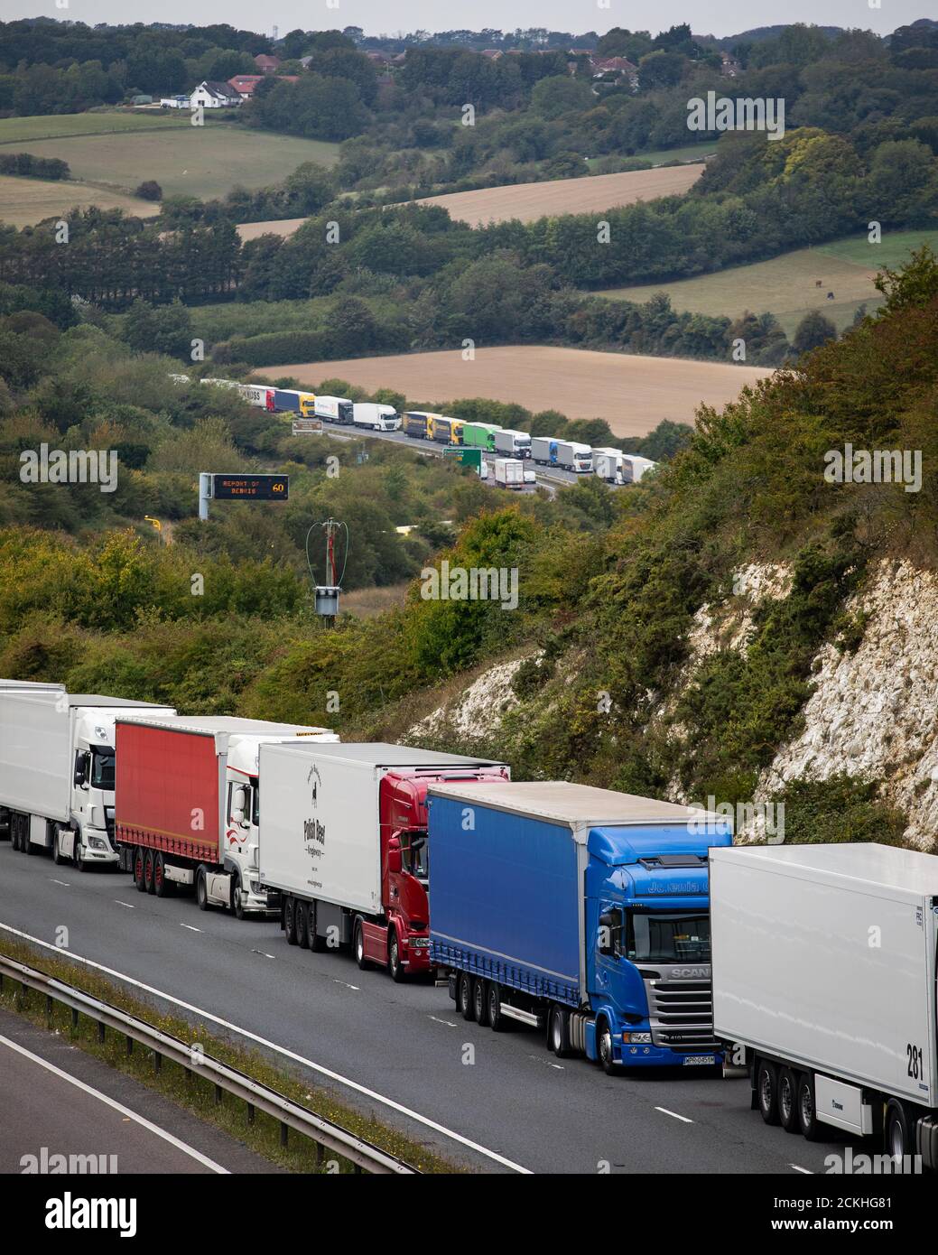 Lorries queue on the A20 near Dover in Kent after a police operation in ...