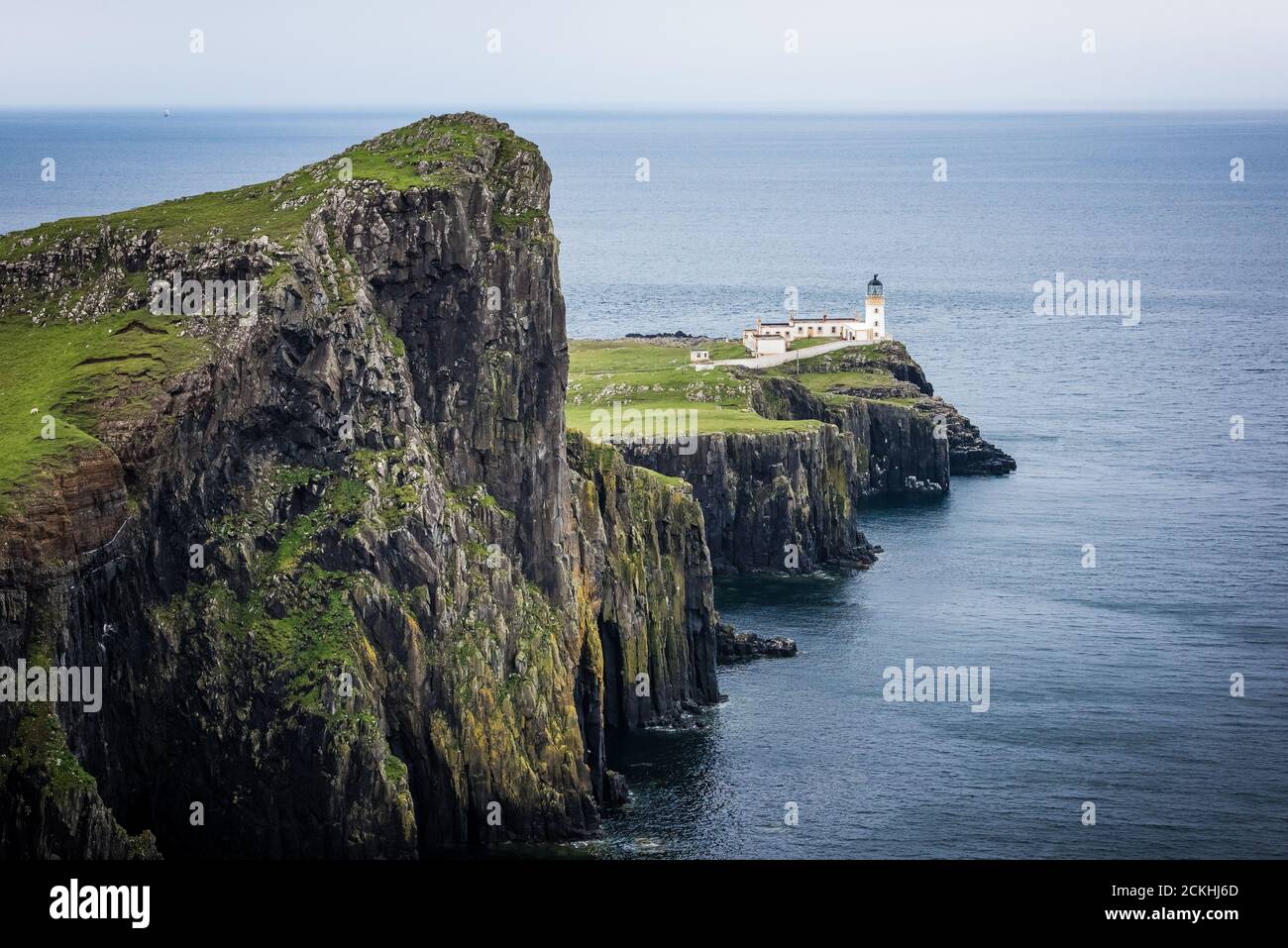 View on the Neist point lighthouse during a cloudy day on the Isle of ...