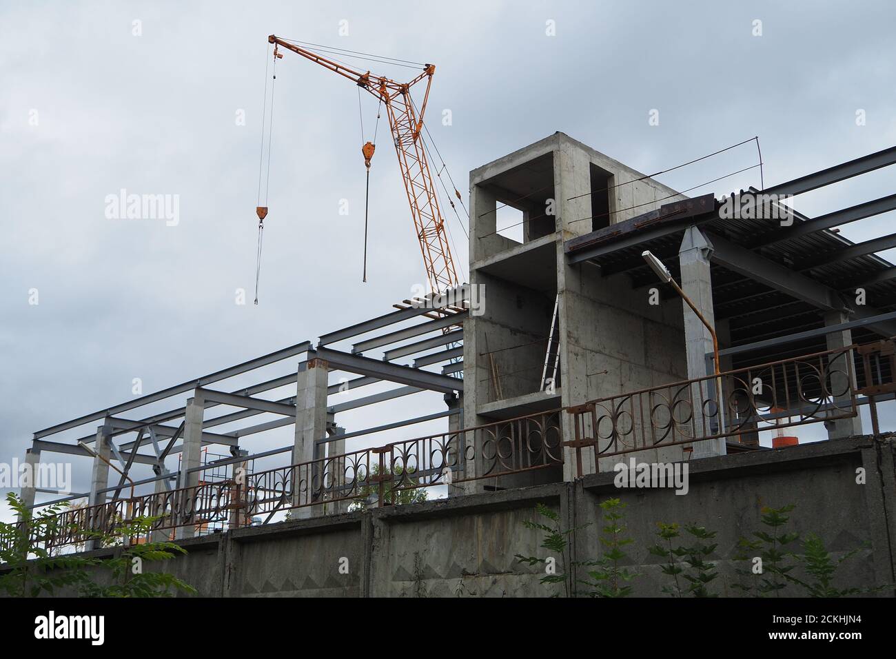 Construction. Construction of the building. The work of the crane Stock ...