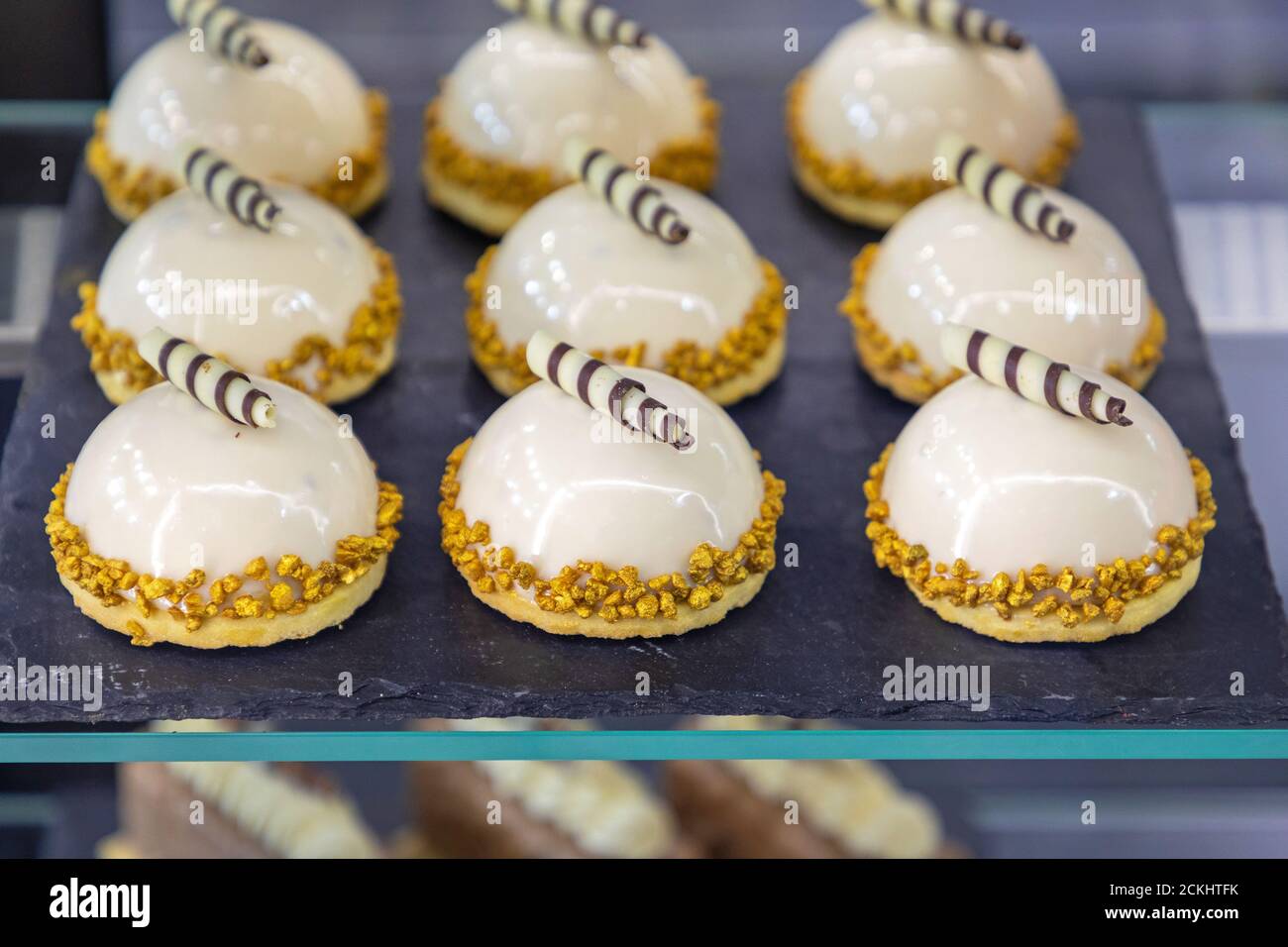 Fancy Cakes With Gold Decor at Slate Stock Photo - Alamy