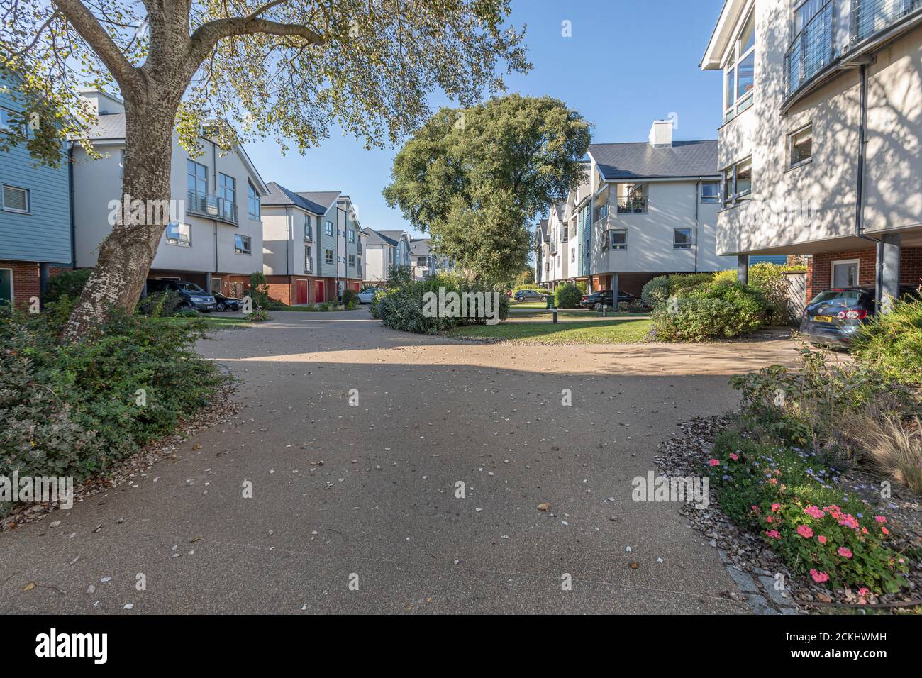 A view down a modern housing development Stock Photo - Alamy