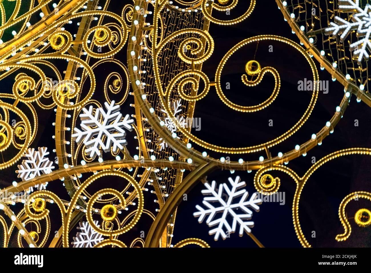 Detail of openwork arch design, construction with neon lighting. City ...