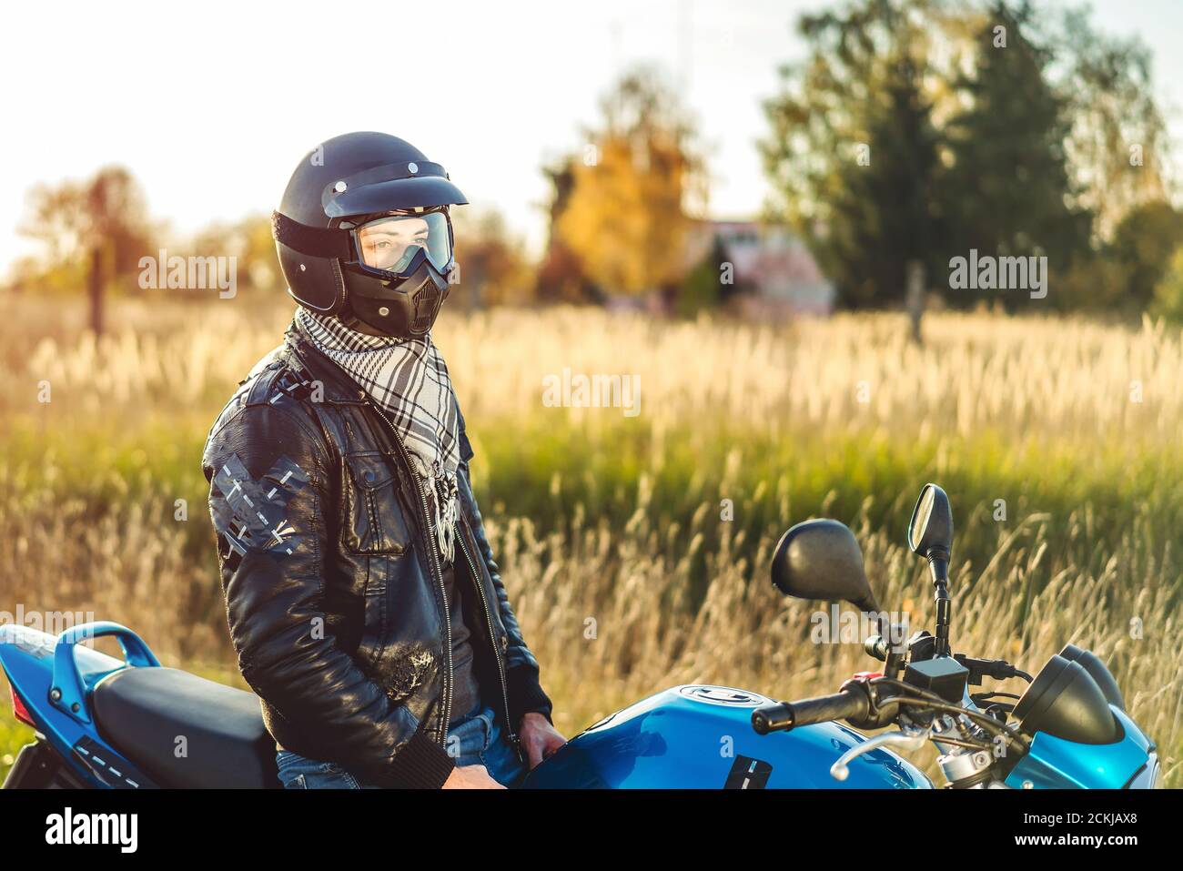 Biker on sport motorcycle outdoor on the road Stock Photo - Alamy