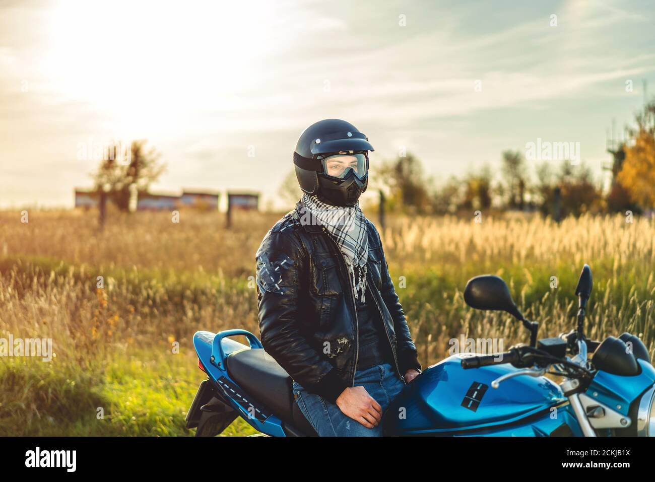 Biker on sport motorcycle outdoor on the road Stock Photo - Alamy