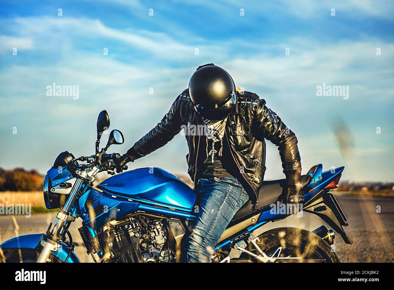 Biker on sport motorcycle outdoor on the road Stock Photo - Alamy