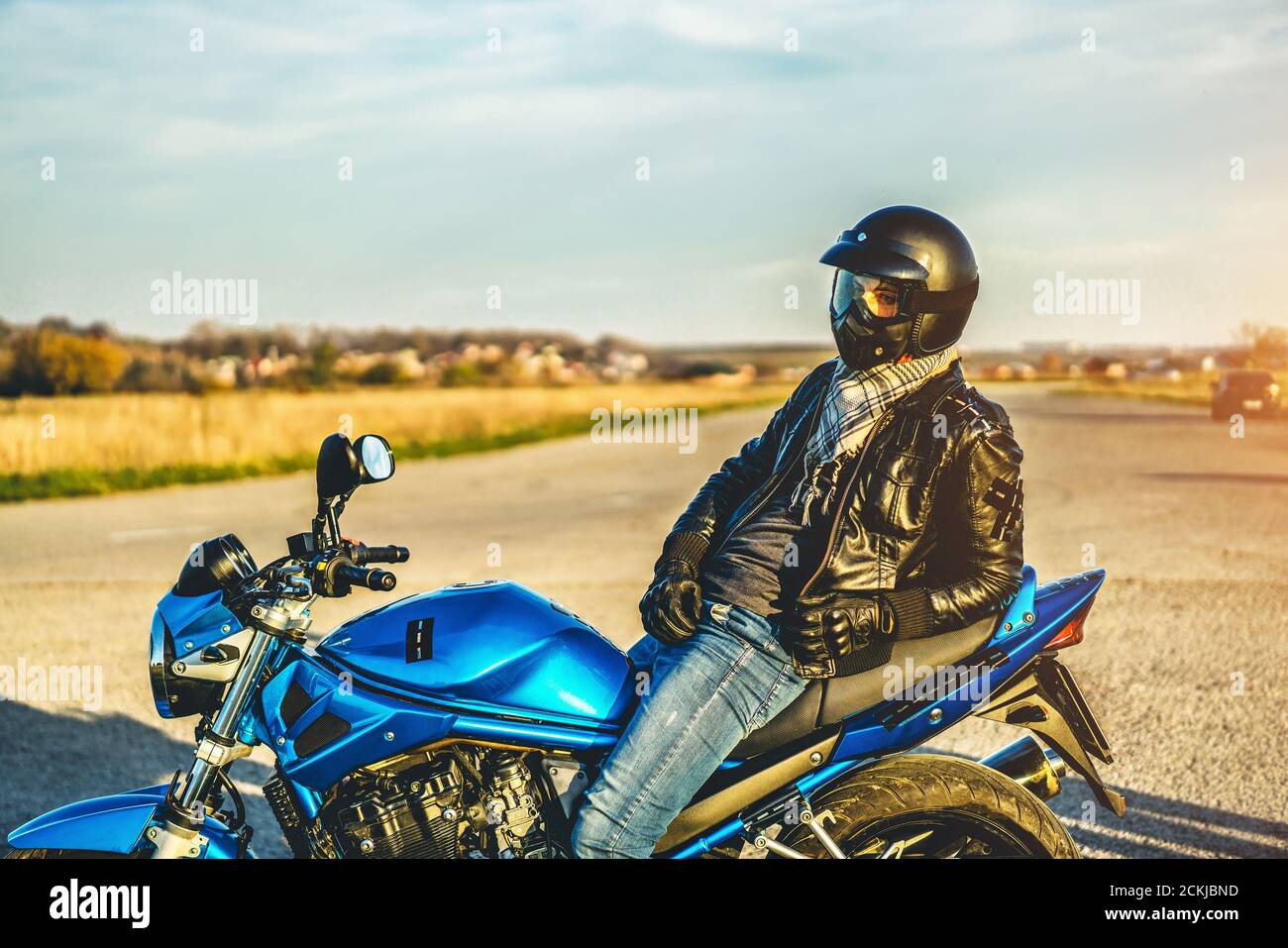 Biker on sport motorcycle outdoor on the road Stock Photo - Alamy