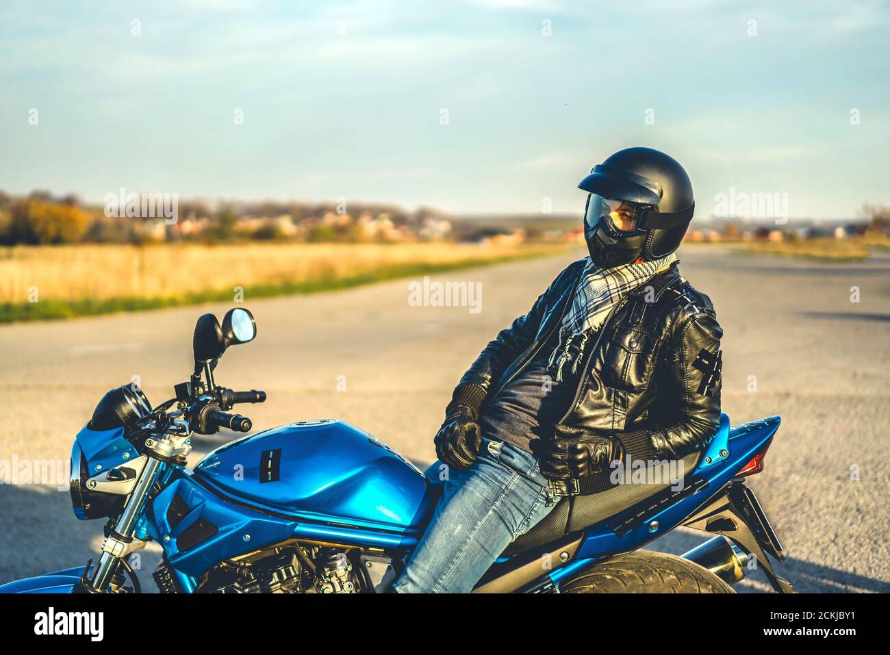 Biker on sport motorcycle outdoor on the road Stock Photo - Alamy