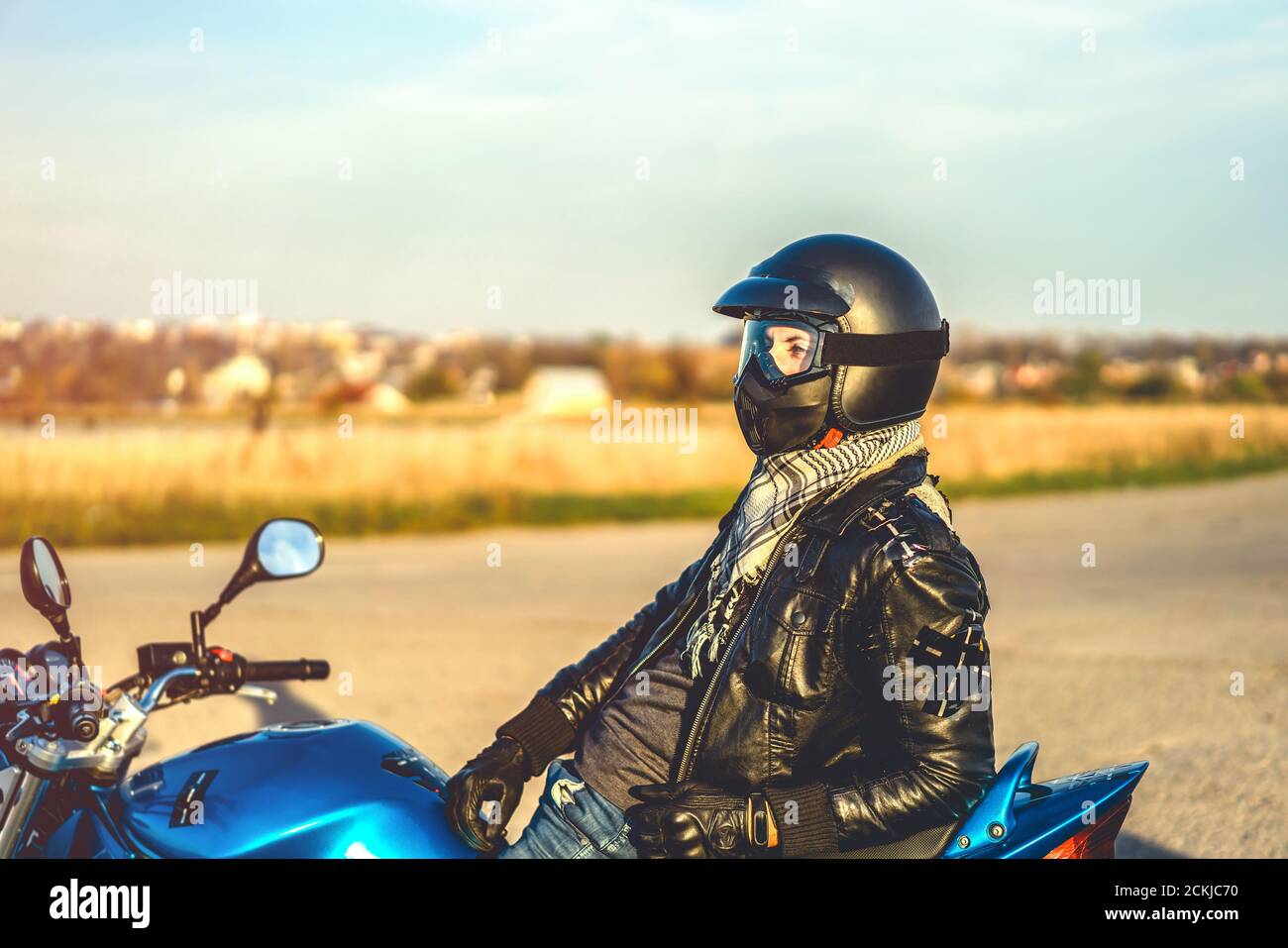 Biker on sport motorcycle outdoor on the road Stock Photo - Alamy