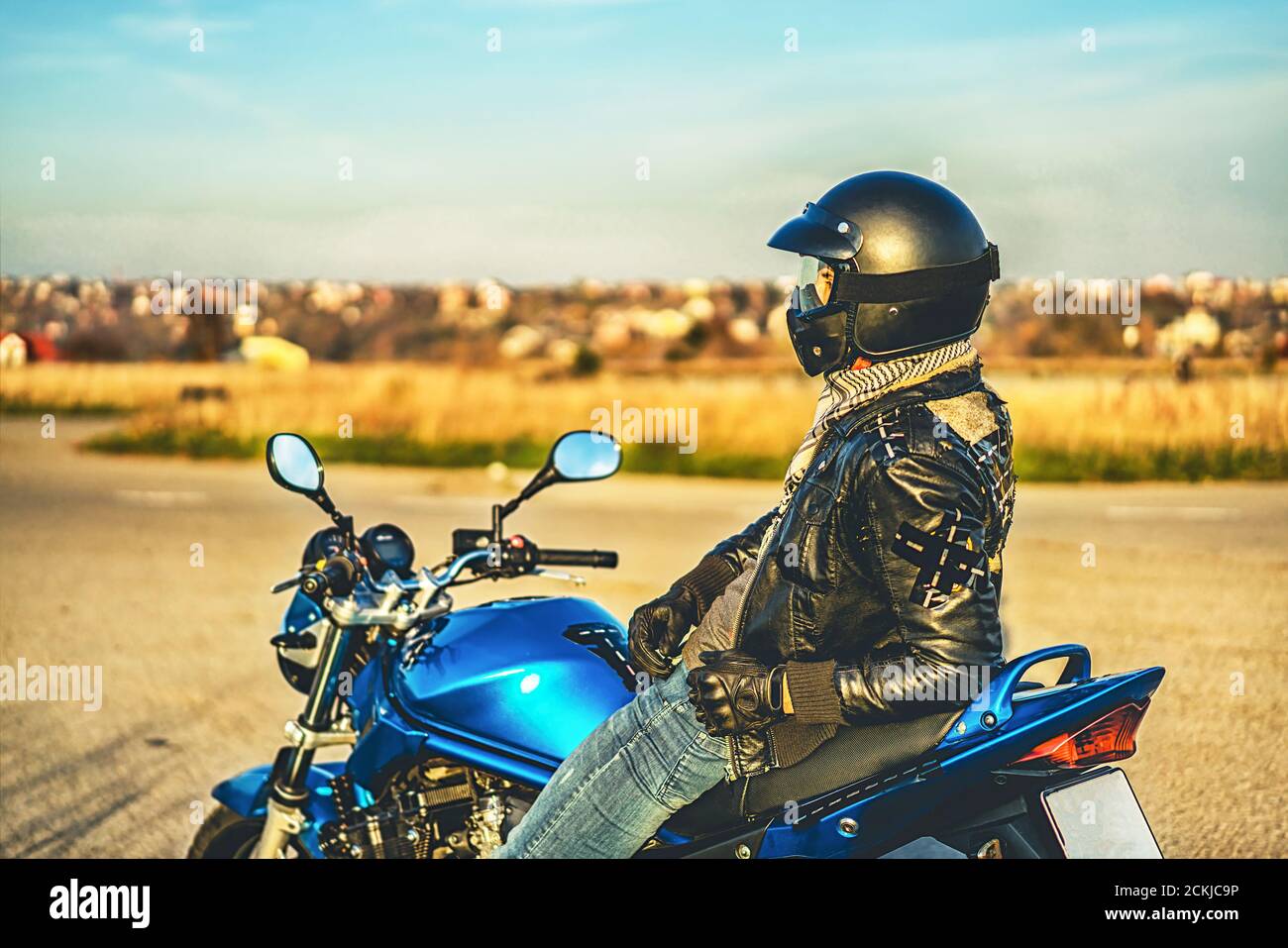 Biker on sport motorcycle outdoor on the road Stock Photo - Alamy