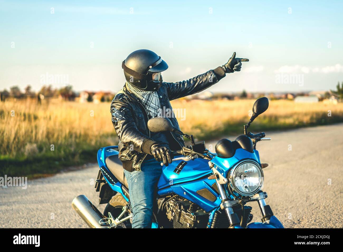 Biker on sport motorcycle outdoor on the road Stock Photo - Alamy