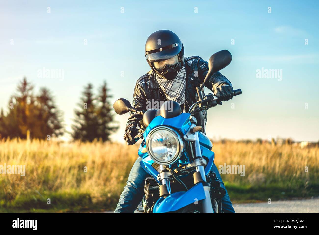 Biker on sport motorcycle outdoor on the road Stock Photo - Alamy