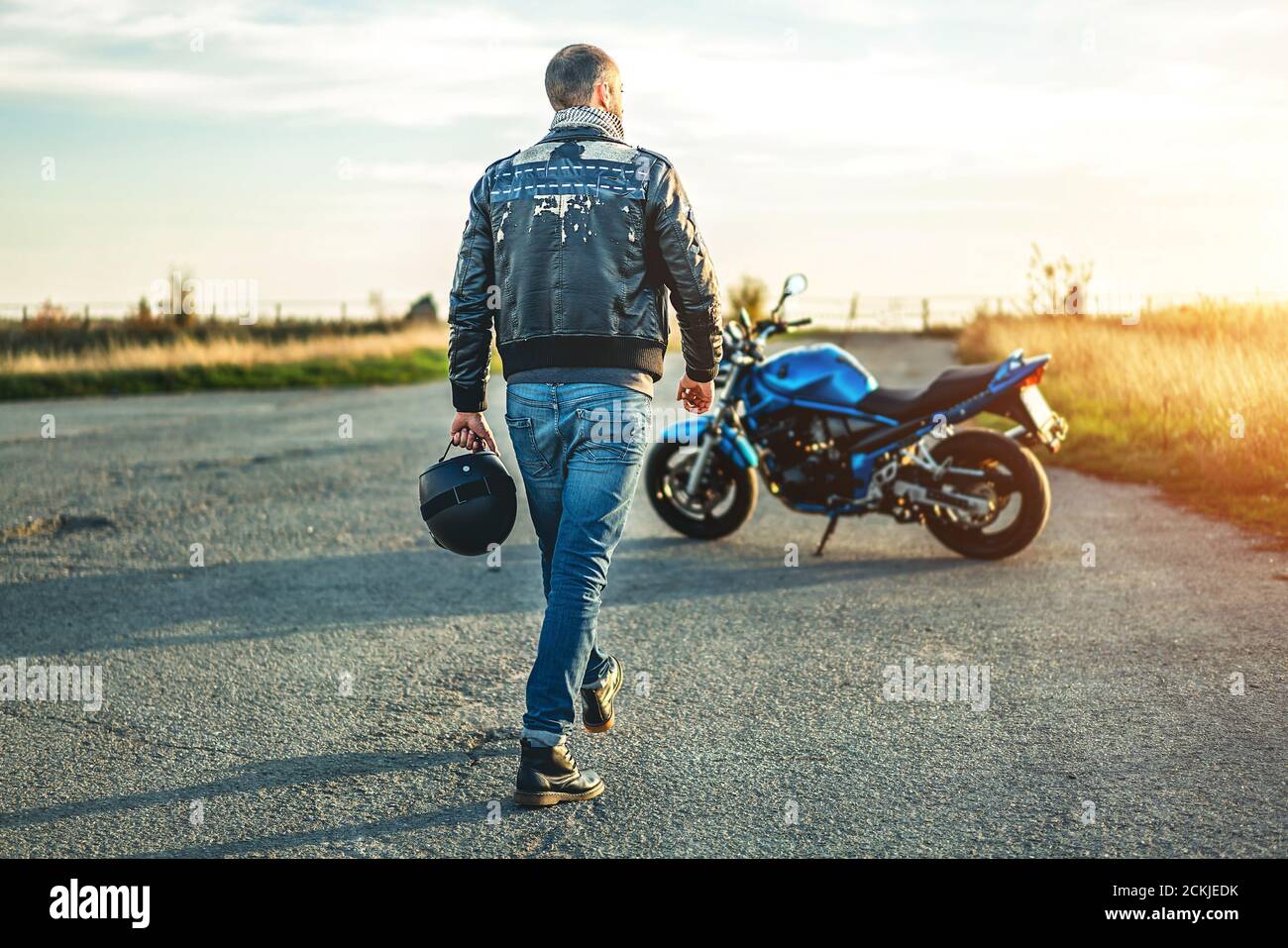 Biker on sport motorcycle outdoor on the road Stock Photo - Alamy