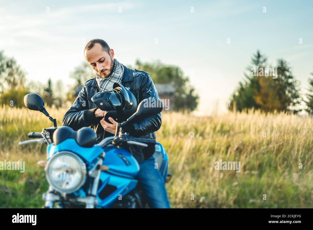 Biker on sport motorcycle outdoor on the road Stock Photo - Alamy