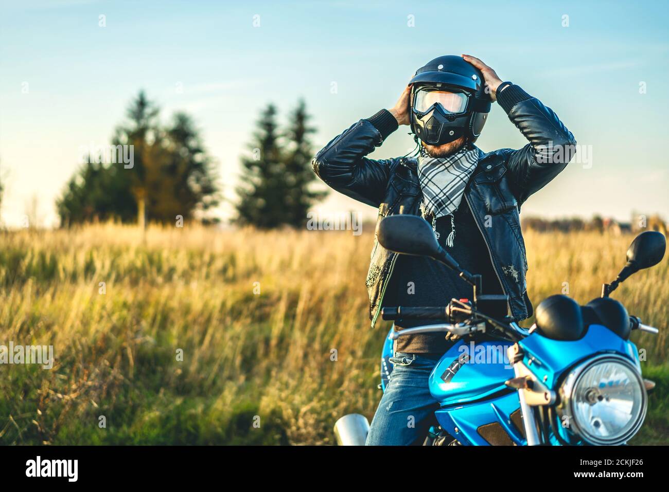 Biker on sport motorcycle outdoor on the road Stock Photo - Alamy