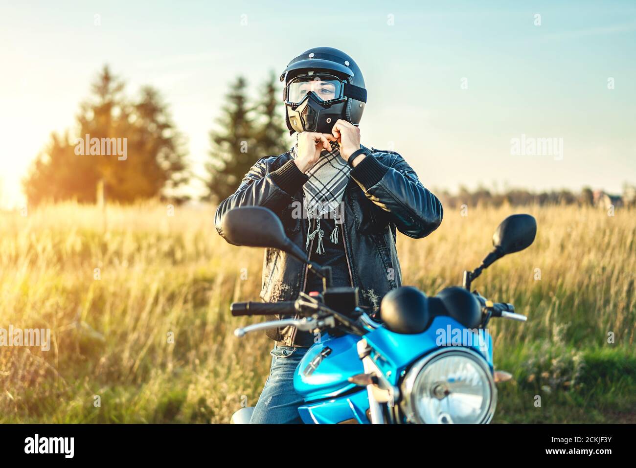 Biker on sport motorcycle outdoor on the road Stock Photo - Alamy