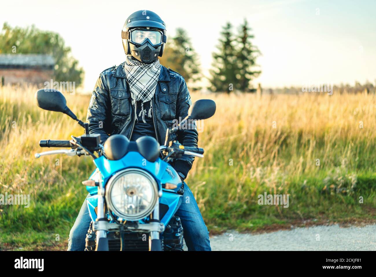 Biker on sport motorcycle outdoor on the road Stock Photo - Alamy