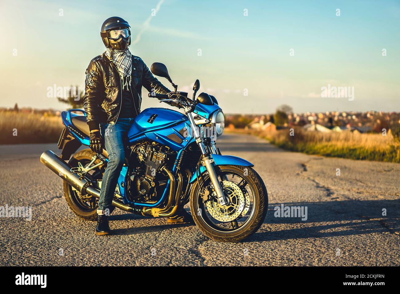 Biker on sport motorcycle outdoor on the road Stock Photo - Alamy