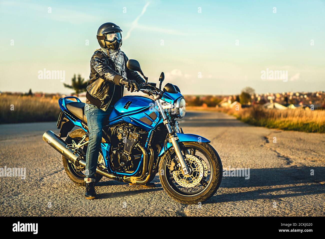 Biker on sport motorcycle outdoor on the road Stock Photo - Alamy
