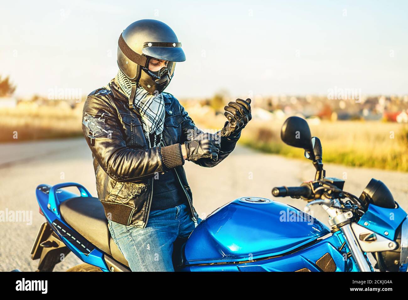 Biker on sport motorcycle outdoor on the road Stock Photo - Alamy