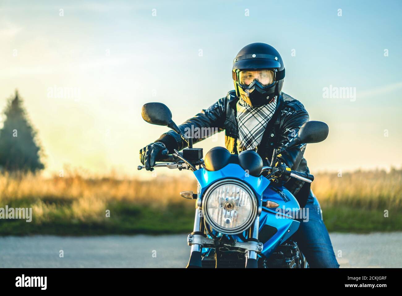 Biker on sport motorcycle outdoor on the road Stock Photo - Alamy