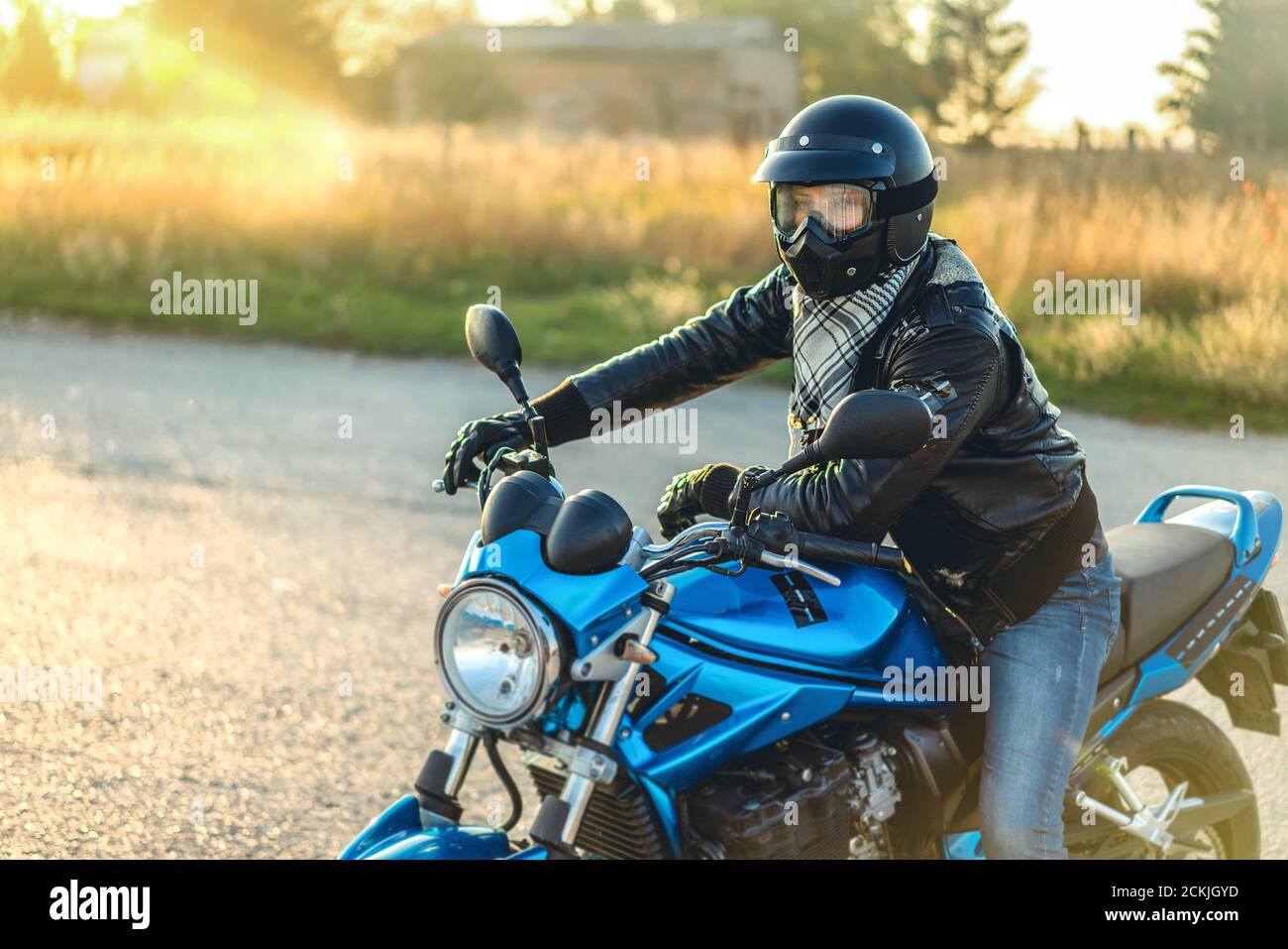 Biker on sport motorcycle outdoor on the road Stock Photo - Alamy