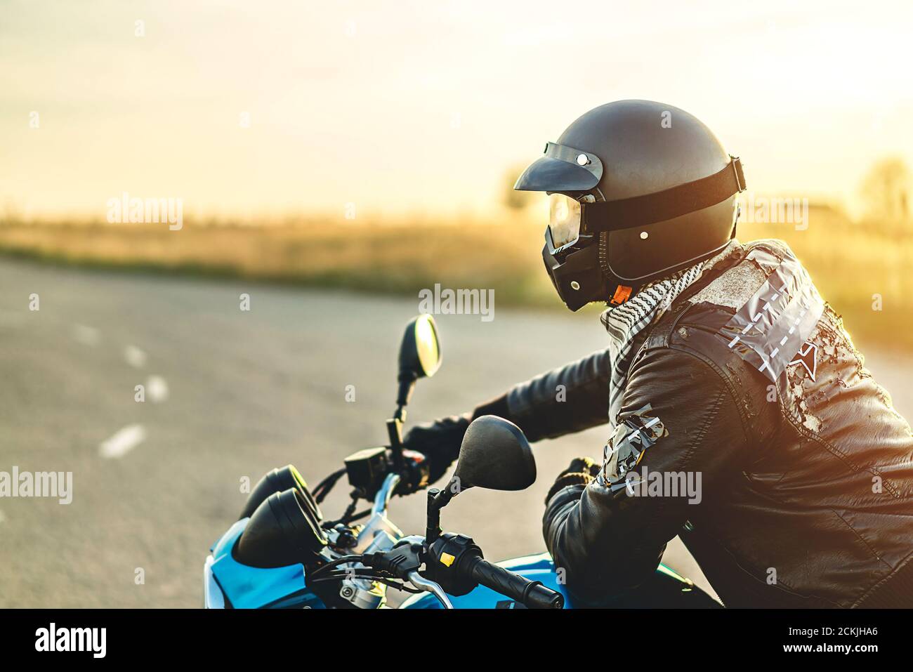 Biker on sport motorcycle outdoor on the road Stock Photo - Alamy