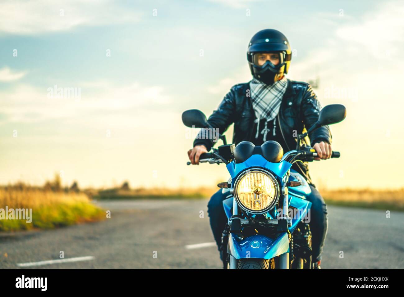 Biker on sport motorcycle outdoor on the road Stock Photo - Alamy