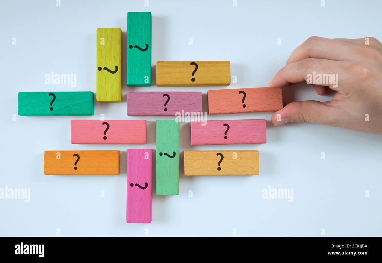 question marks on wooden cube. frequently asked questions concept Stock ...