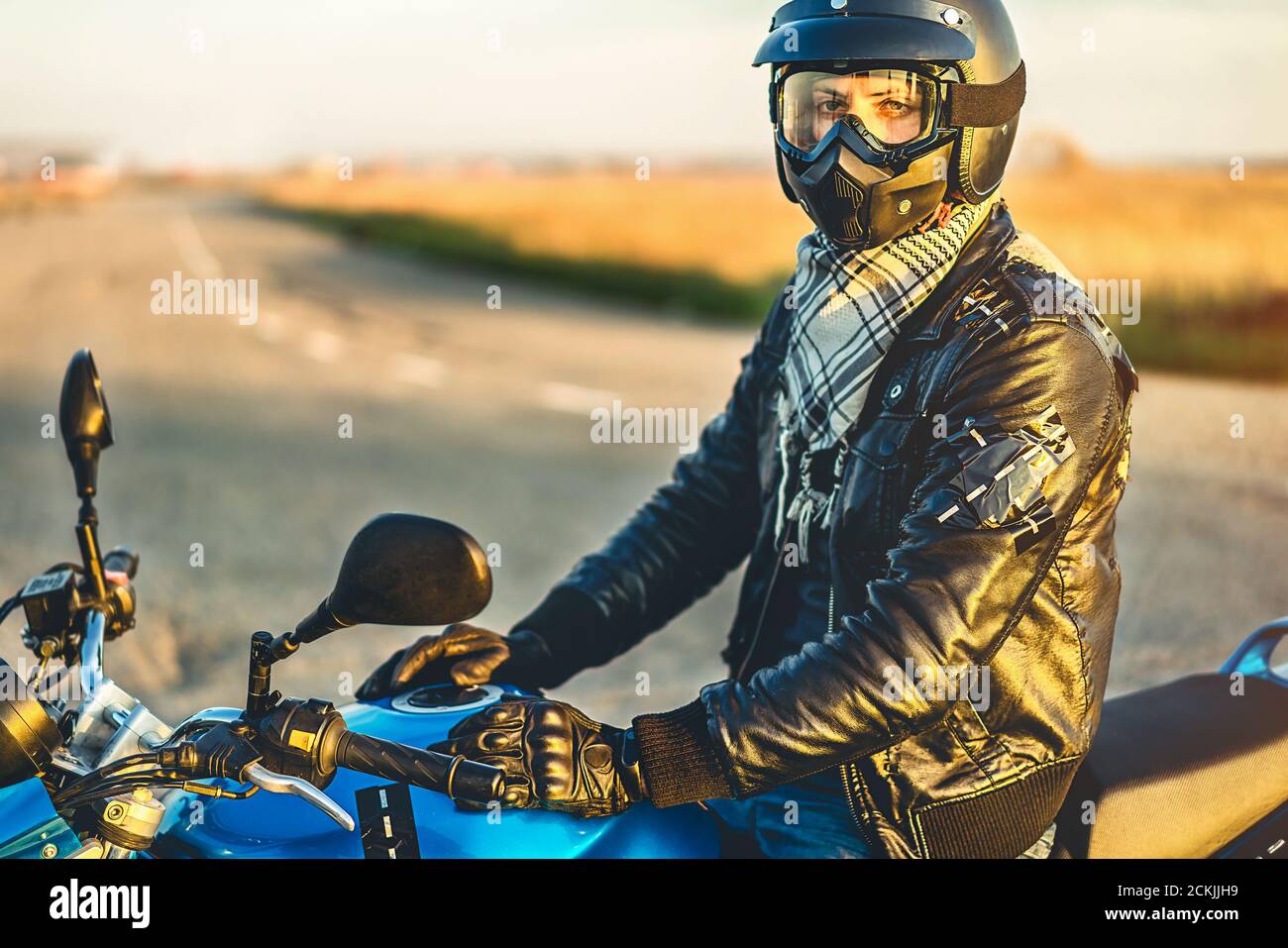 Biker on sport motorcycle outdoor on the road Stock Photo - Alamy