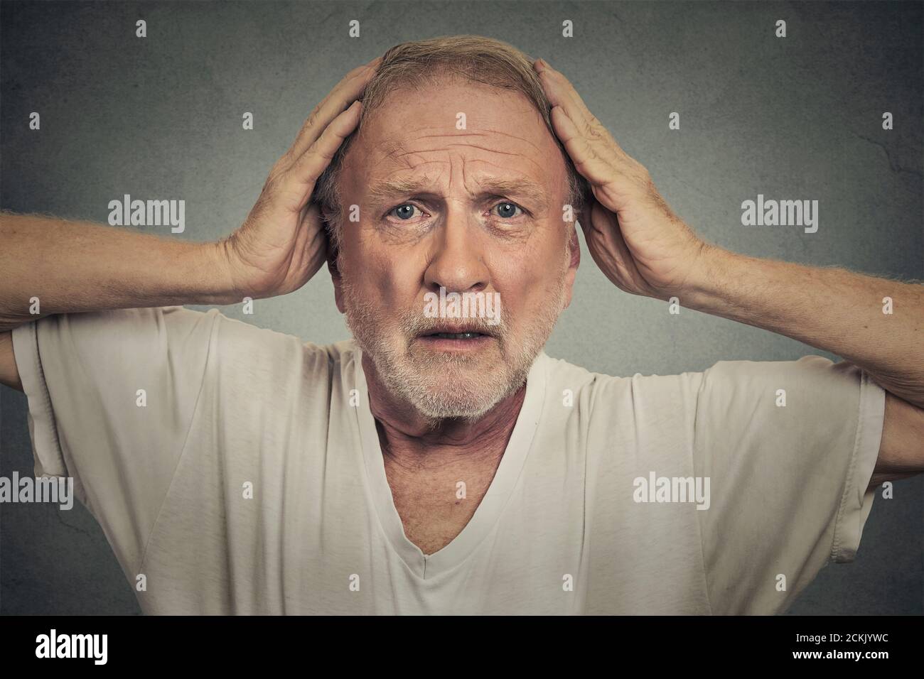 Shocked sad senior man Stock Photo - Alamy