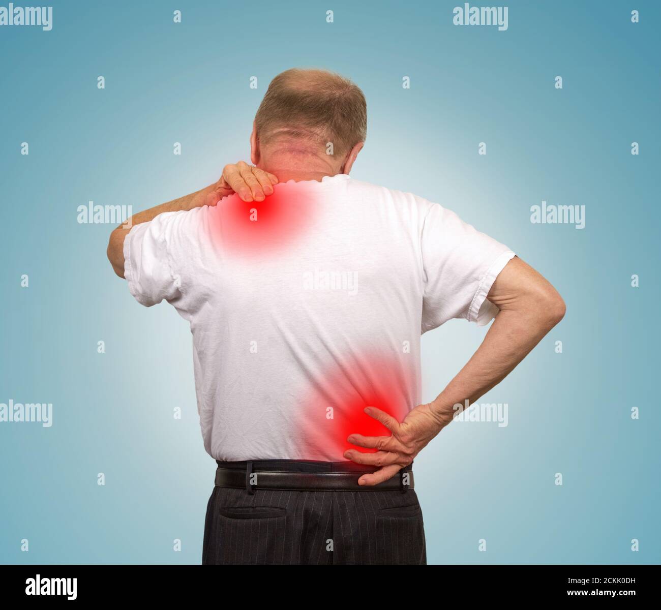 Senior elderly man with lower and upper back pain isolated on light ...
