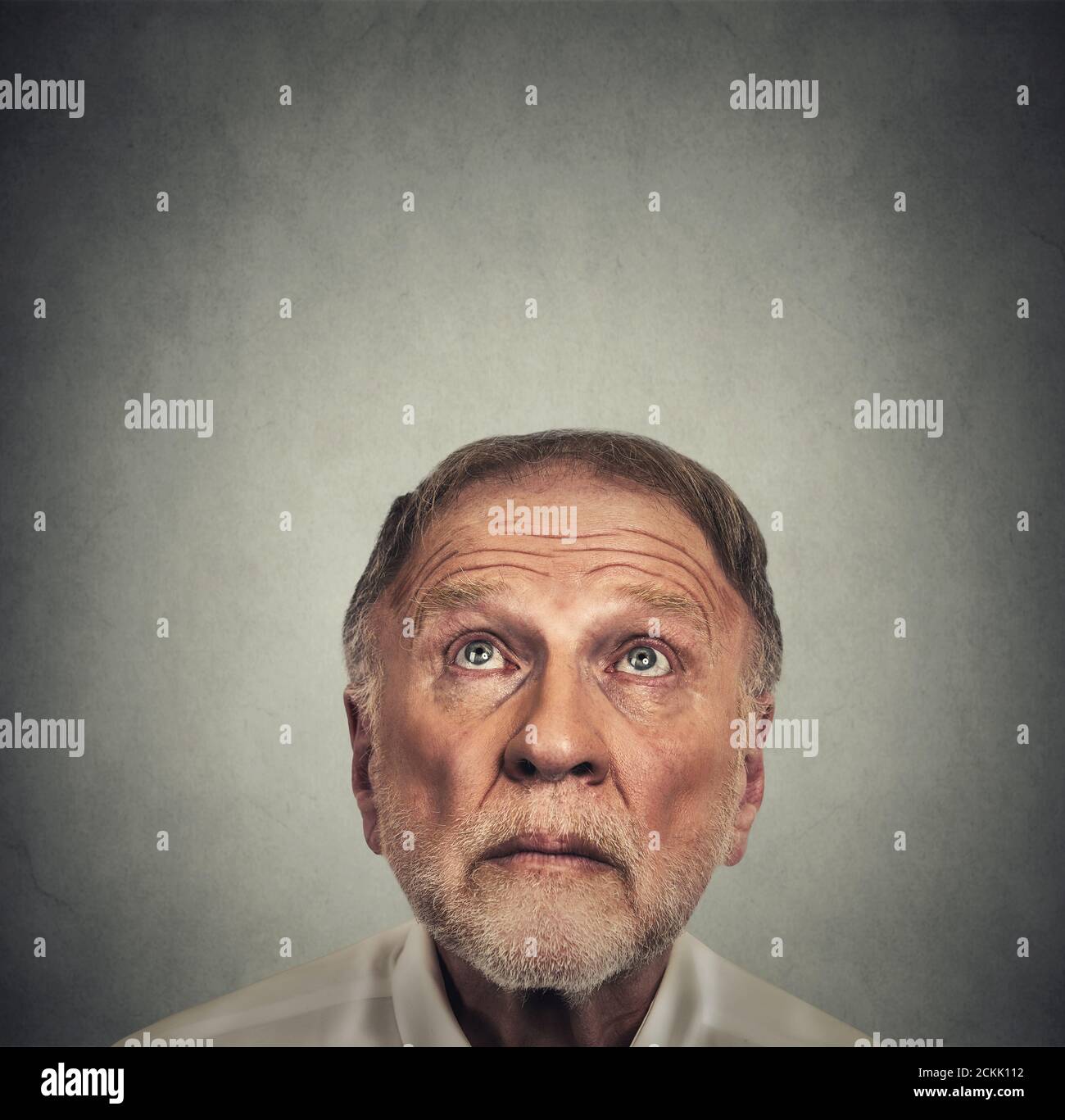 Headshot elderly man looking up Stock Photo - Alamy