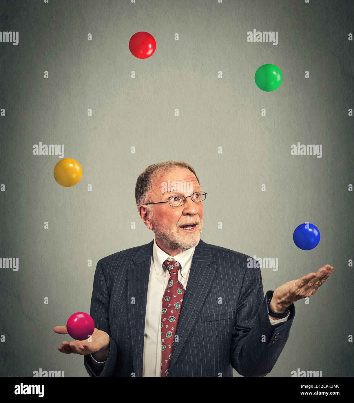 Portrait mature business man juggling multitasking Stock Photo - Alamy