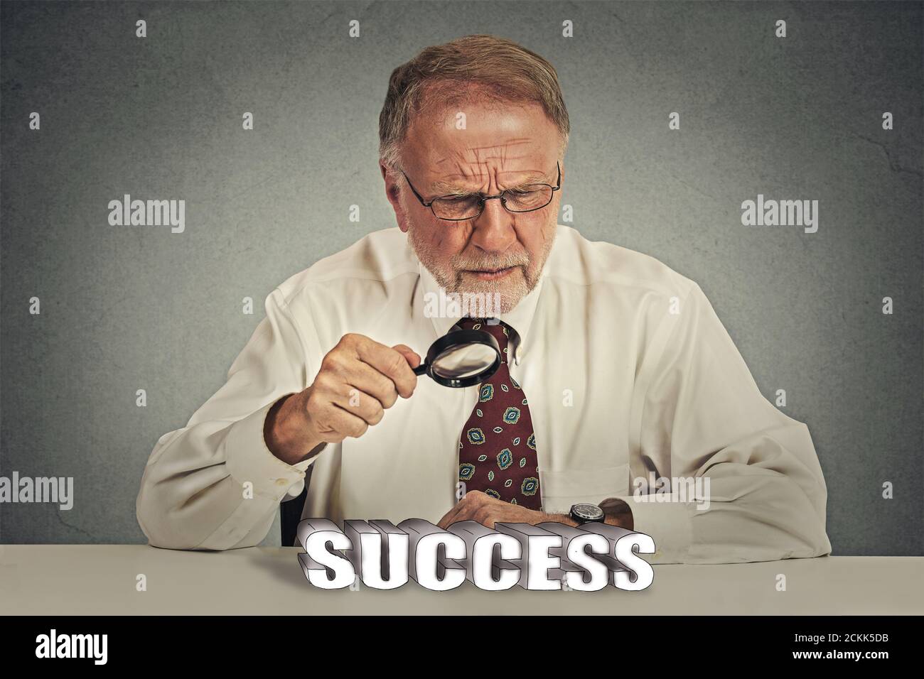 Skeptical look at success. Senior business man mature boss in suit ...