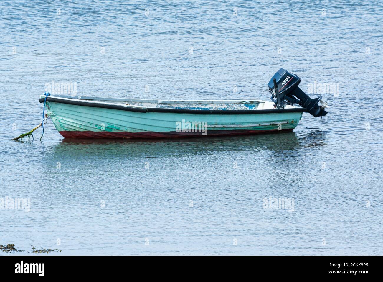 A small blue boat at anchor off of Porthloo Beach, St Mary's, Isles of ...