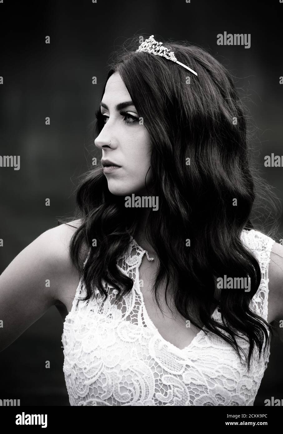 Vertical grayscale shot of a beautiful caucasian woman's portrait ...