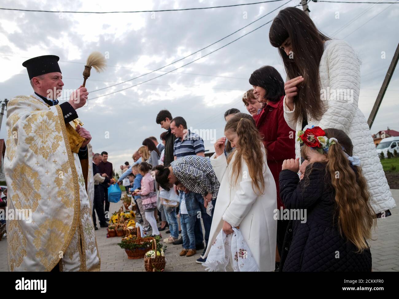 Catholic priest sprinkles holy water hi-res stock photography and ...