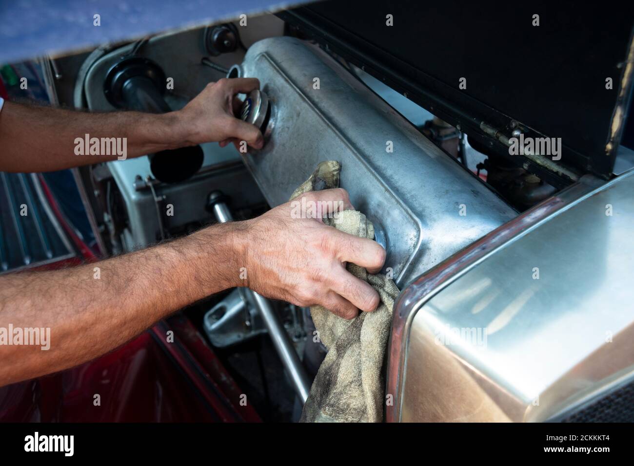 Mechanic Works on Repairing a Old Cars Stock Photo - Alamy