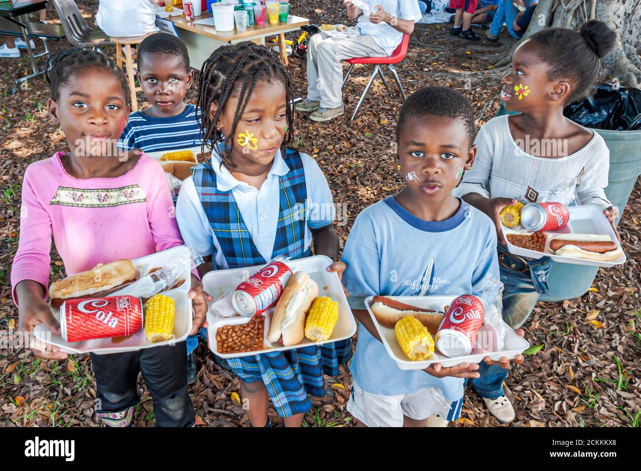 Boy boys male girl girls female outside class picnic trays hi-res stock ...