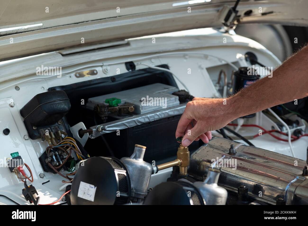 Mechanic Works on Repairing a Old Cars Stock Photo - Alamy