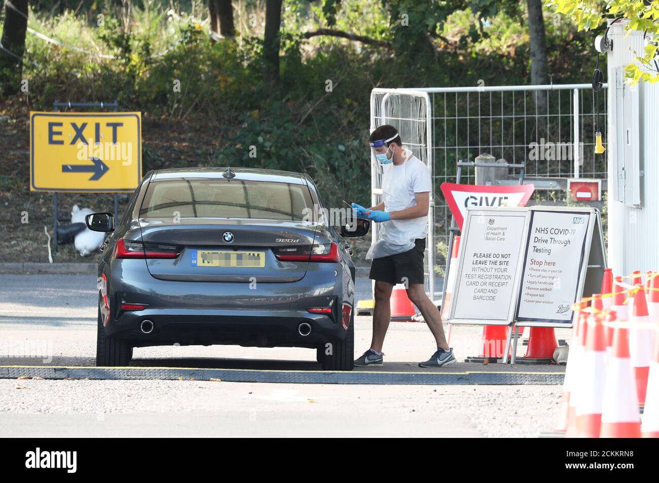 NUMBER PLATE PIXELATED BY PA PICTURE DESK A medical worker takes a swab ...