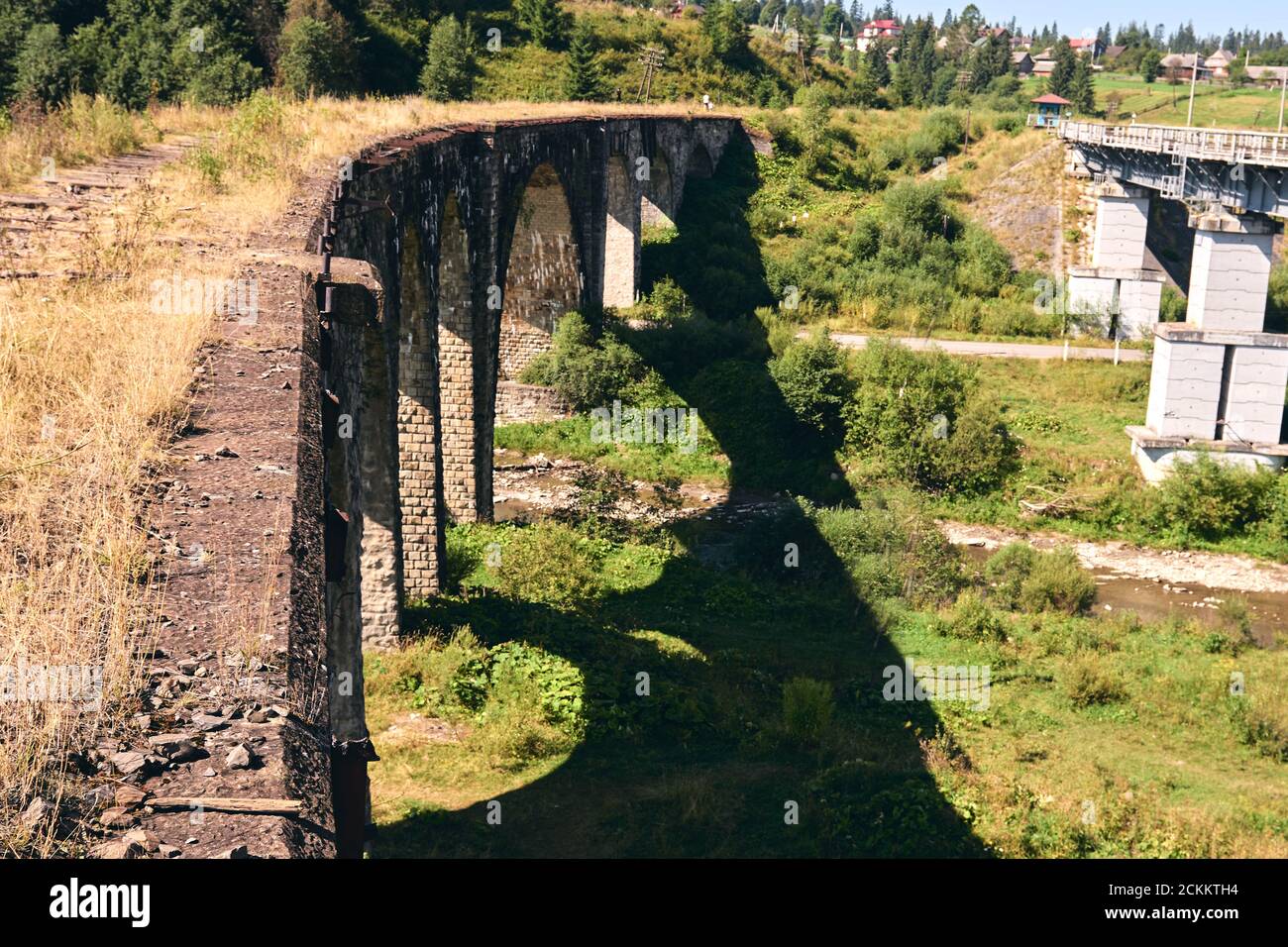 Panorama view of ancient bridge. Old railway viaduct in the mountain ...