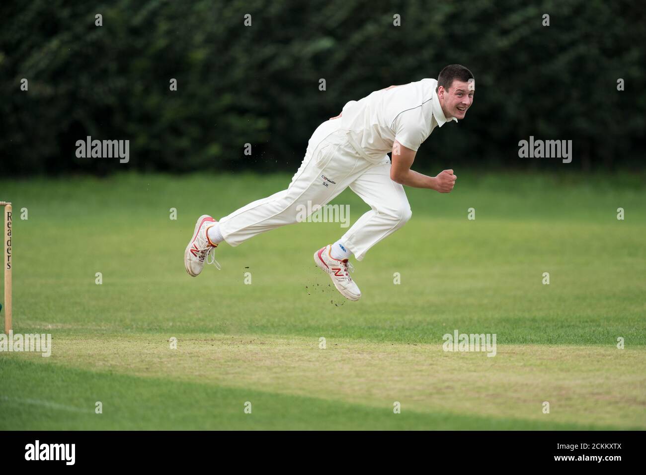 Cricket bowler in action Stock Photo - Alamy