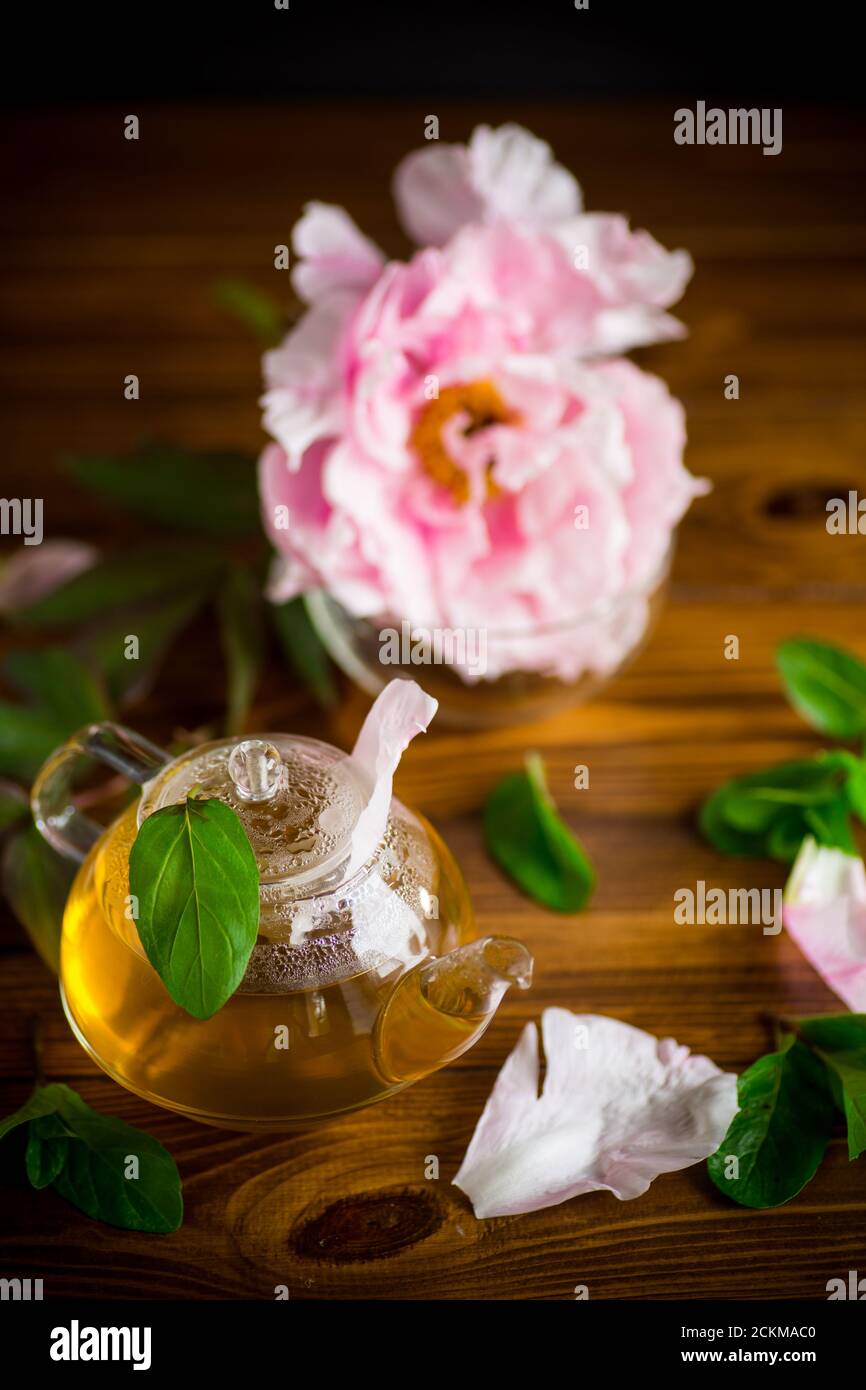 summer flower tea from rose petals in a glass teapot Stock Photo - Alamy