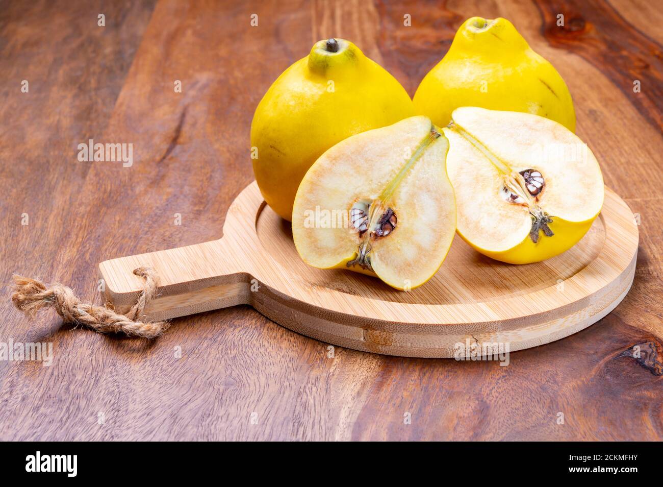 Group of ripe yellow quince apples close up Stock Photo - Alamy